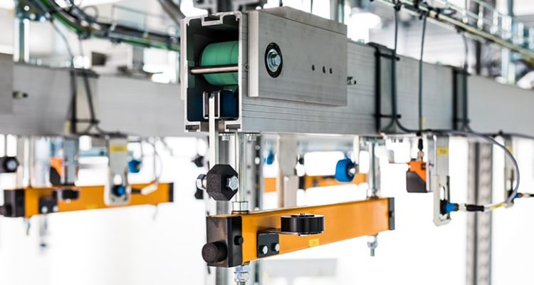 Overhead conveyors for flexible pickup, storage and production solutions